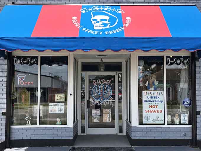 That bold blue and red awning announces this isn't your grandfather's barbershop, though he'd probably love it anyway.
