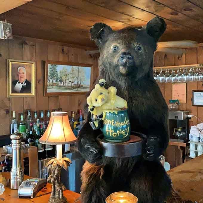The taxidermy bear holding honey at the bar explains the restaurant's name and adds quirky charm to the space.