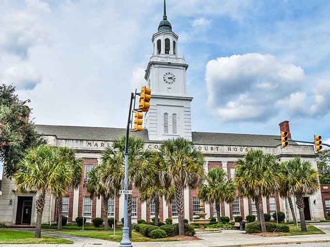 The Marlboro County Courthouse commands attention with its clock tower and palm-lined dignity that anchors downtown.