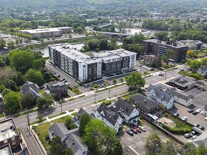 Aerial views revealing a city where green space and affordable housing aren't mutually exclusive concepts from fantasy novels.