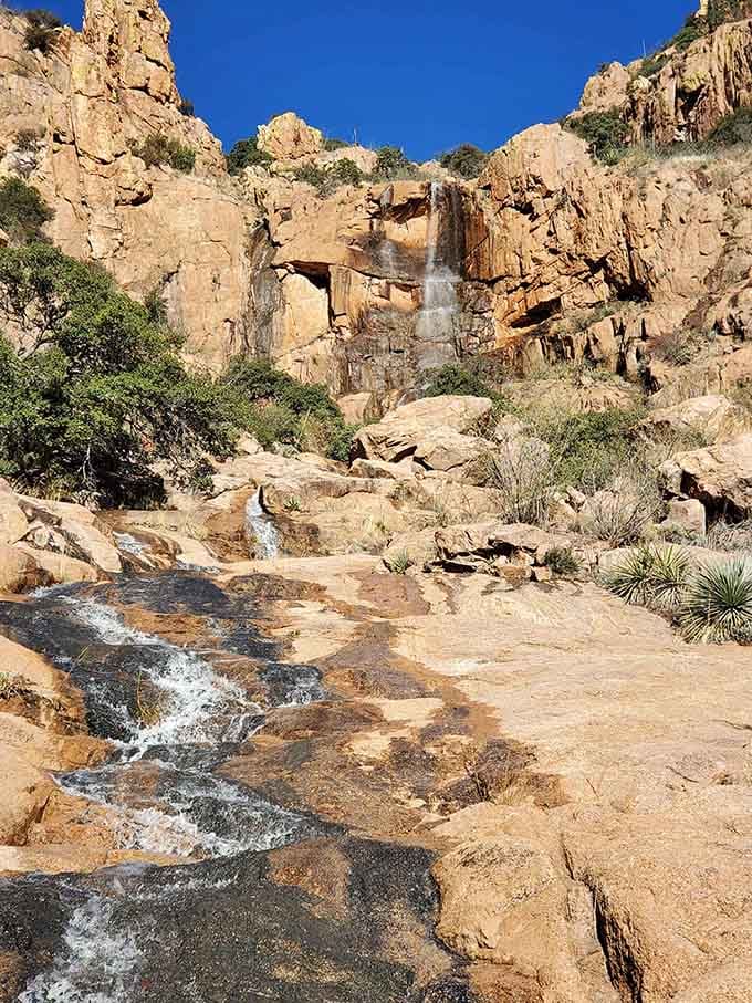 Desert waterfalls cascade over golden rocks, proving that Arizona saves its best surprises for those willing to explore beyond expectations.