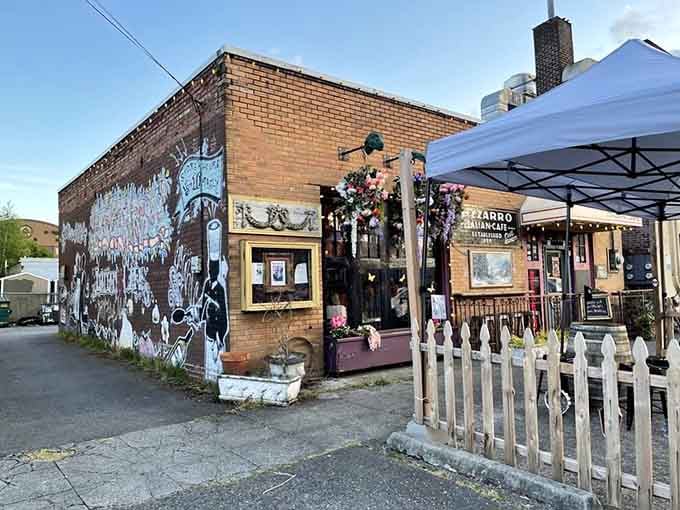 The exterior mural and flower-draped facade announce that ordinary dining experiences simply don't happen here, friends.