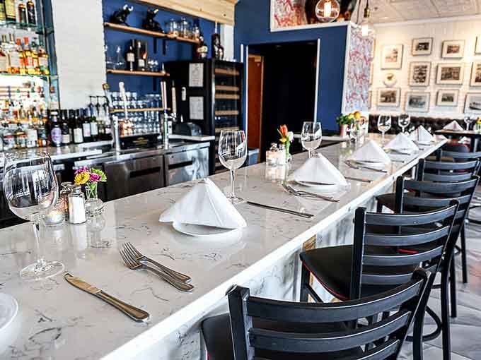 Marble countertop dining offers front-row seats to the action, perfect for solo diners or couples seeking something different.