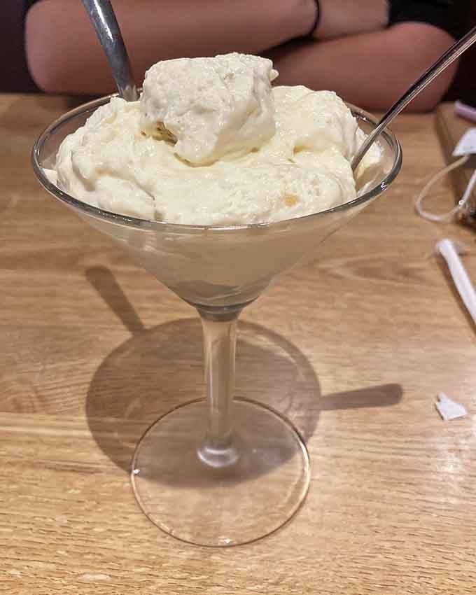 Banana pudding served in a martini glass, proving dessert can be fancy even when you're wearing barbecue sauce.