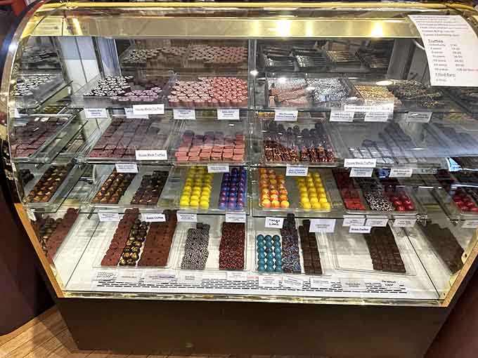 Row after row of handcrafted chocolates and truffles gleaming like precious gems in this treasure chest.