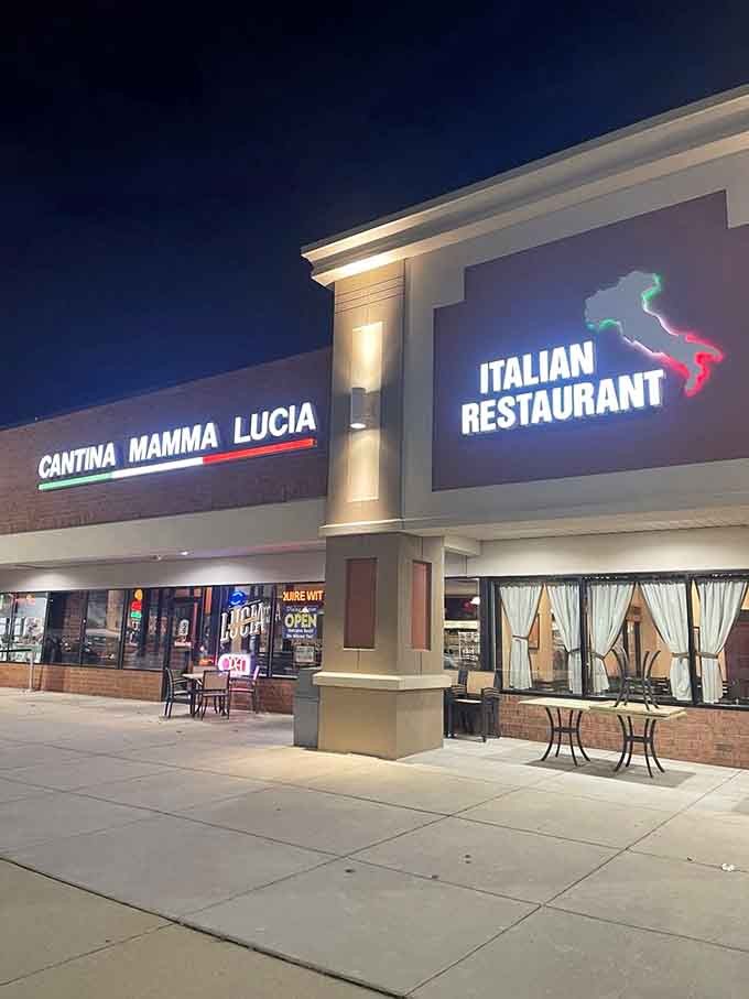 Evening lights illuminate Cantina Mamma Lucia's welcoming entrance, a beacon for hungry diners seeking Italian comfort and joy.