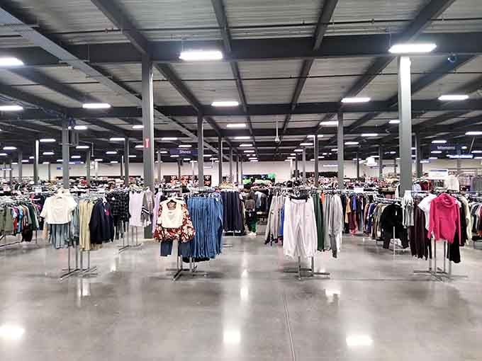 Endless racks of clothing creating a treasure hunt atmosphere where finding your size feels like winning the lottery.