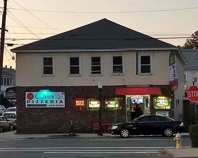 As twilight falls, those glowing neon signs beckon hungry travelers to discover what award-winning pizza tastes like.
