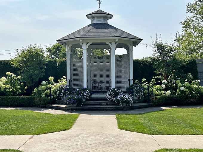 This gazebo surrounded by blooming hydrangeas practically begs you to sit down and enjoy the peaceful gardens.