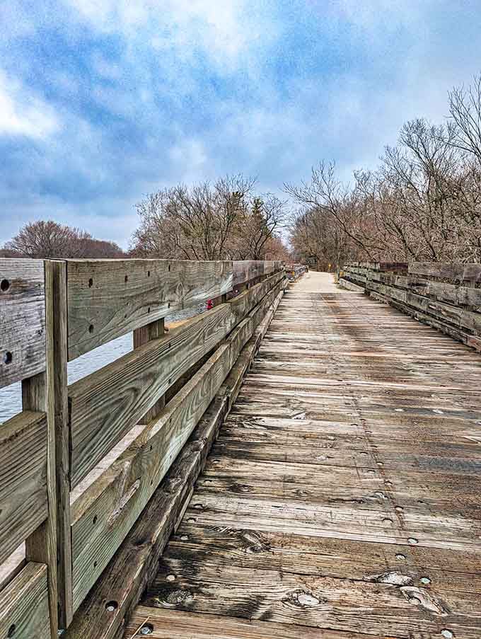 The wooden bridge over the canal offers prime viewing spots where the light hits just right during golden hour.