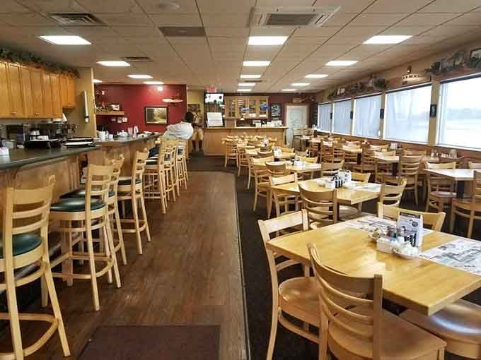The dining room's layout ensures everyone gets a good view of the action happening just beyond those generous windows.