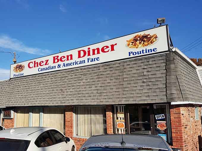 Blue skies frame the rooftop sign announcing poutine loud and proud, like a beacon for hungry travelers everywhere.