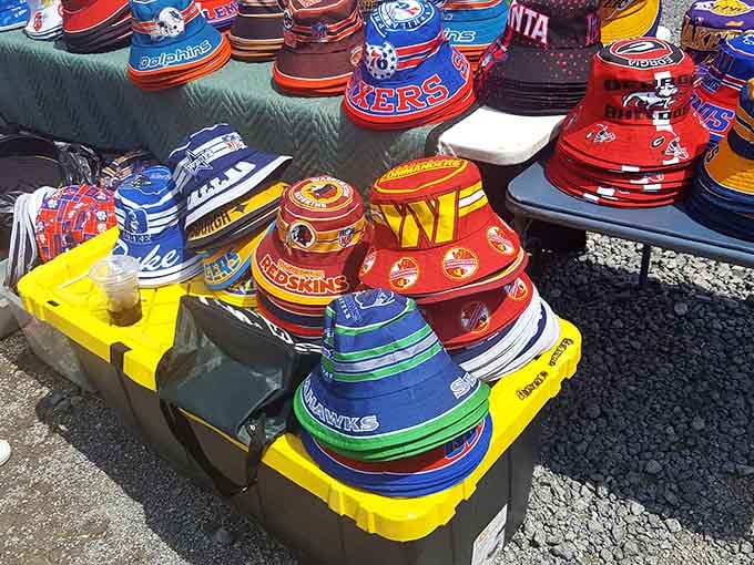 Sports team bucket hats stacked high prove fandom comes in all shapes, sizes, and questionable fashion choices.