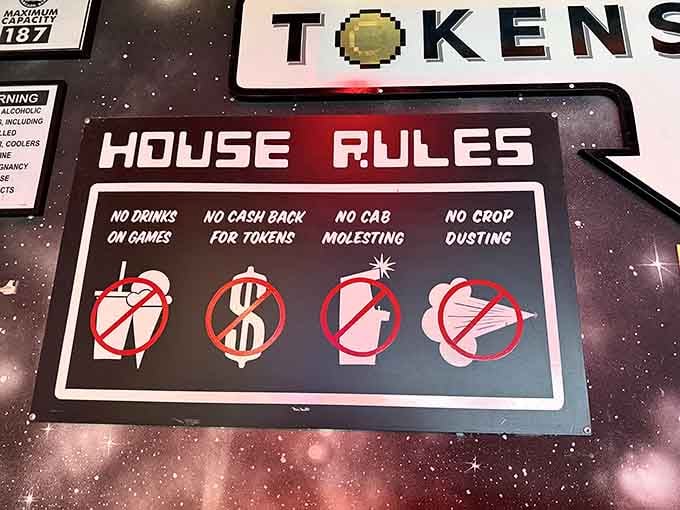 House rules clearly stated: no drinks on games, no cash back for tokens, and absolutely no crop dusting.