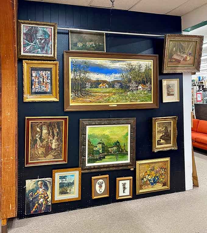 Framed artwork creating a gallery wall that would make any museum curator nod approvingly while adjusting their glasses.