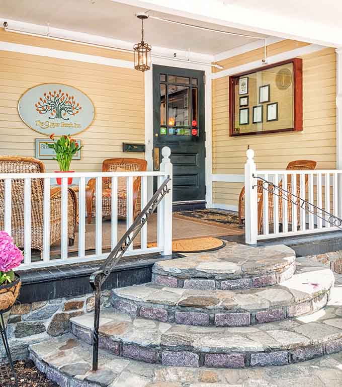 The welcoming entrance with its charming steps and cheerful flowers promises the exceptional experience waiting inside for you.