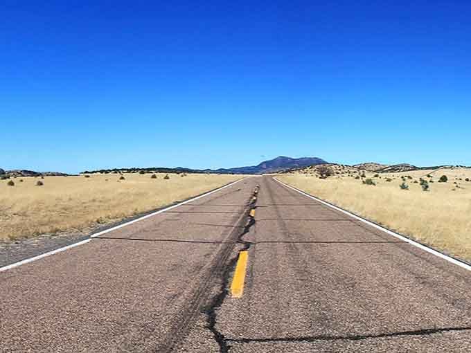 Sometimes the straightaways are just as beautiful as the curves, stretching toward distant mountain ranges.