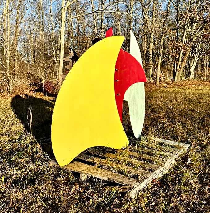 Bright painted steel brings a playful energy to the woods, like modern art crashed a nature documentary.