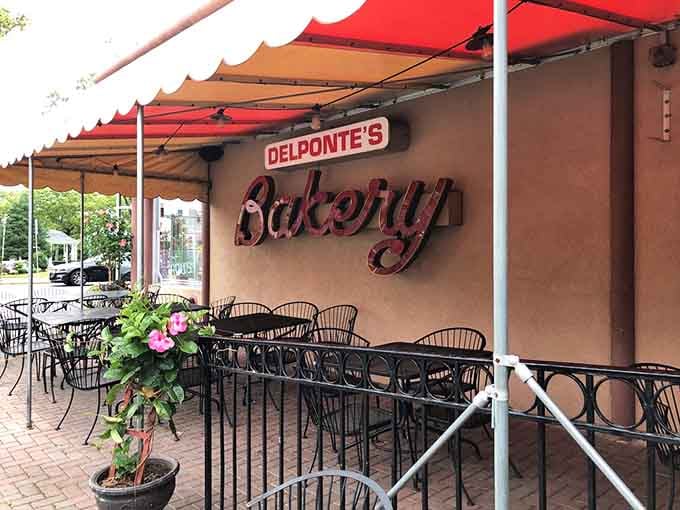 Shaded patio seating invites lingering over coffee and sweets, turning a quick stop into a proper shore town moment.