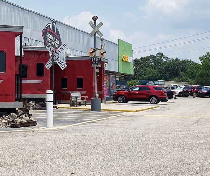 Railroad crossing signals in the parking lot mean you've definitely arrived somewhere special, not just another forgettable roadside stop.