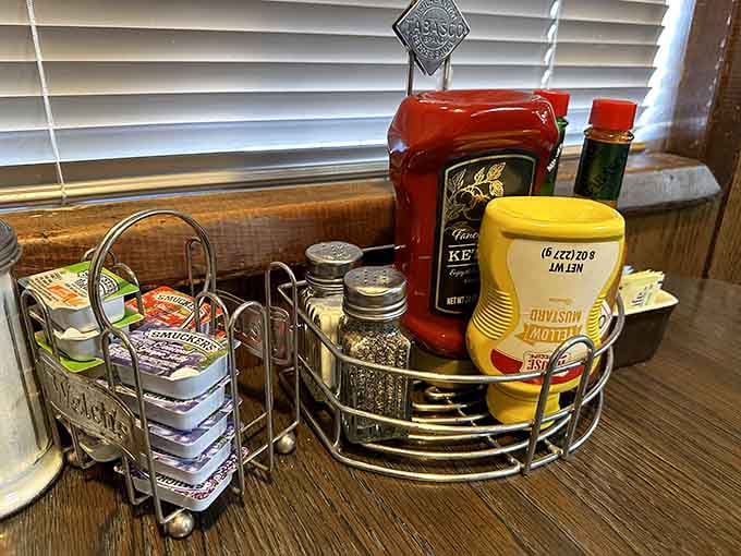 Table condiments at the ready because good diner food deserves proper seasoning options always.