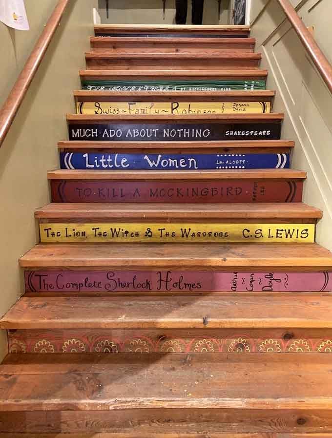 Literary classics painted on stair risers turn every trip upstairs into a walk through beloved stories.