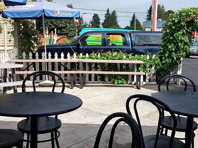 Outdoor seating with planters and umbrellas makes this the perfect spot to enjoy your burger haul.