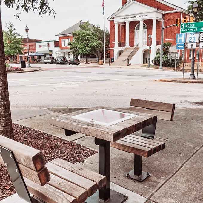 A checkerboard table on the square invites you to slow down, sit a spell, and play like time doesn't matter.