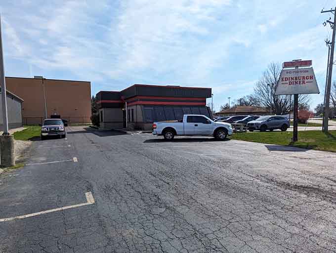 The parking lot fills up because word travels fast when you're serving Indiana's most ridiculously oversized tenderloin sandwich around.