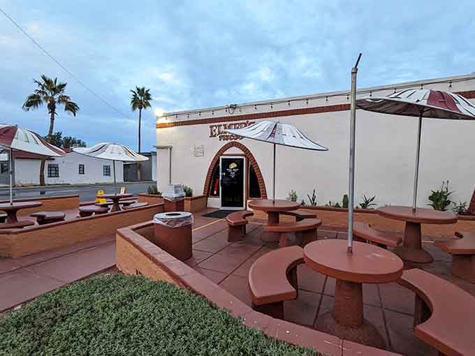 The front patio at dusk, umbrellas ready for tomorrow's crowd&mdash;this place knows how to welcome you home.