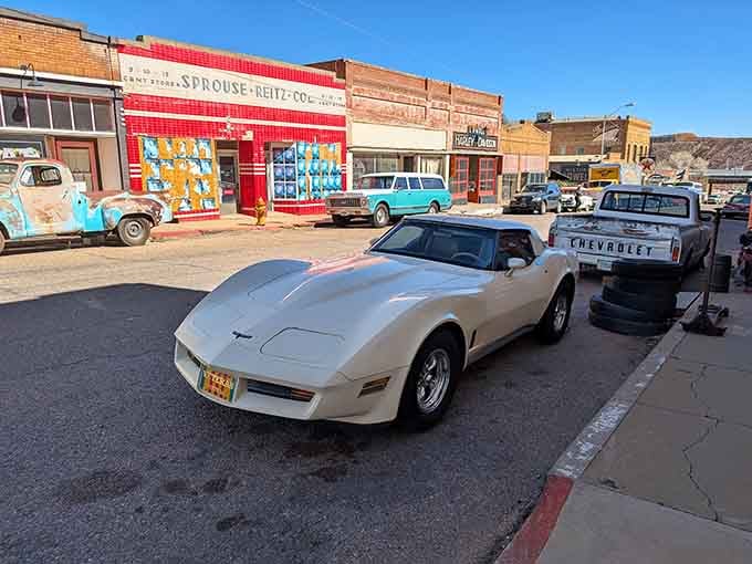 A white Corvette sits ready to blast "Don't Stop Believin'" while cruising into a sunset that never quite arrives here.