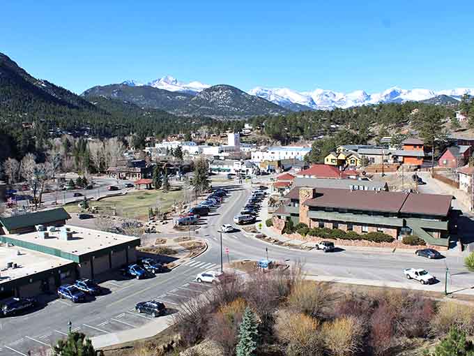 The aerial view reveals Estes Park nestled in the valley like nature's own perfect postcard come to life.