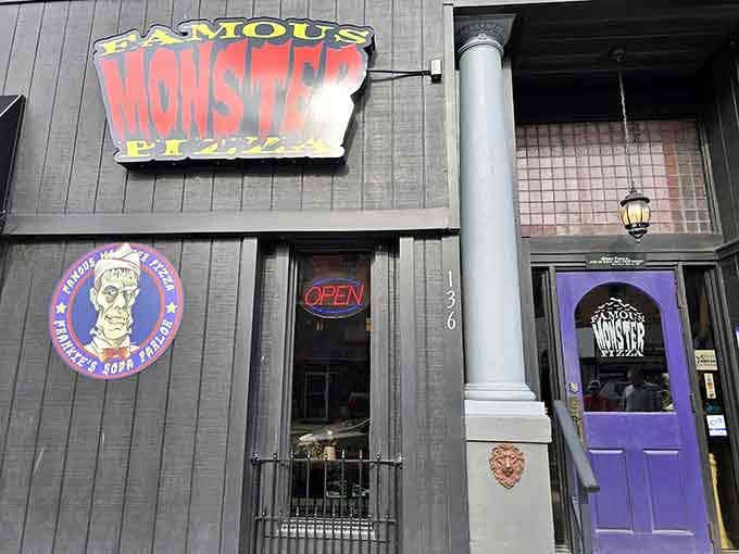 The storefront promises exactly what it delivers: famous monsters, fantastic pizza, and unforgettable memories.