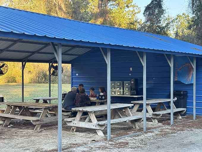 Picnic tables under a covered pavilion where you can enjoy your seafood feast without worrying about seagulls stealing your lunch.