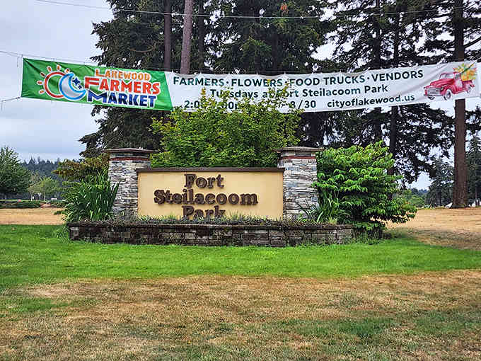 The park entrance welcomes you with stone pillars that hint at the storybook adventure waiting just beyond.
