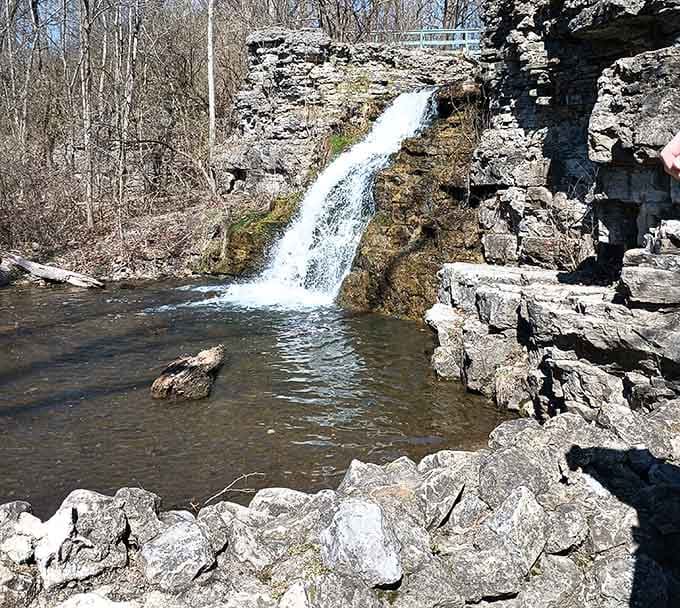The waterfall pools into a limestone basin, creating the kind of scene that makes you wonder why you ever vacation elsewhere.