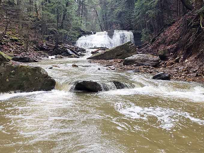 The view downstream shows how the waterfall continues its journey, always moving and always beautiful.