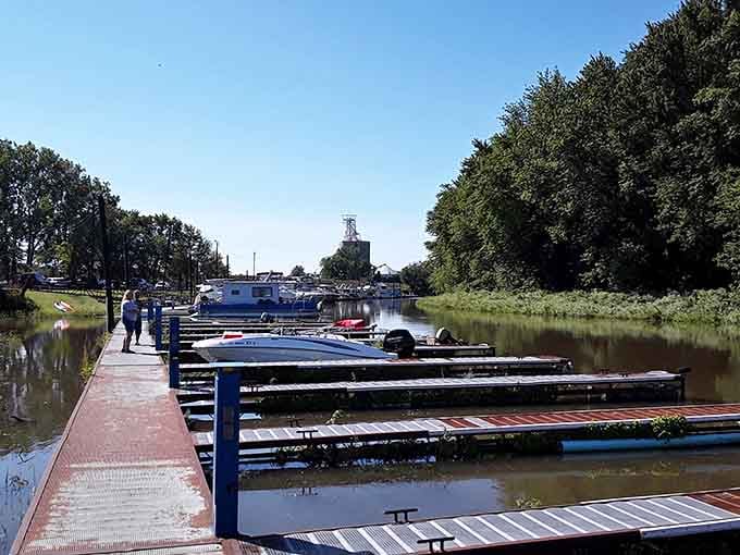 The marina offers front-row seats to river life, where boats rest and fishermen contemplate their strategies.