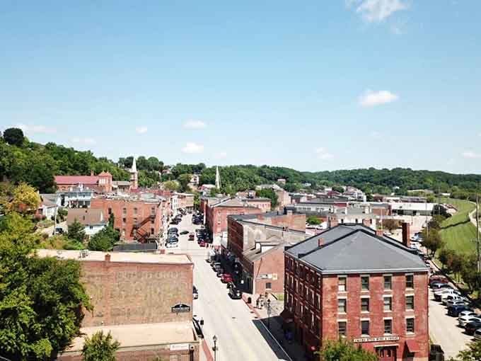 The aerial view reveals Galena nestled in rolling hills, looking like a model train set that somehow became real.
