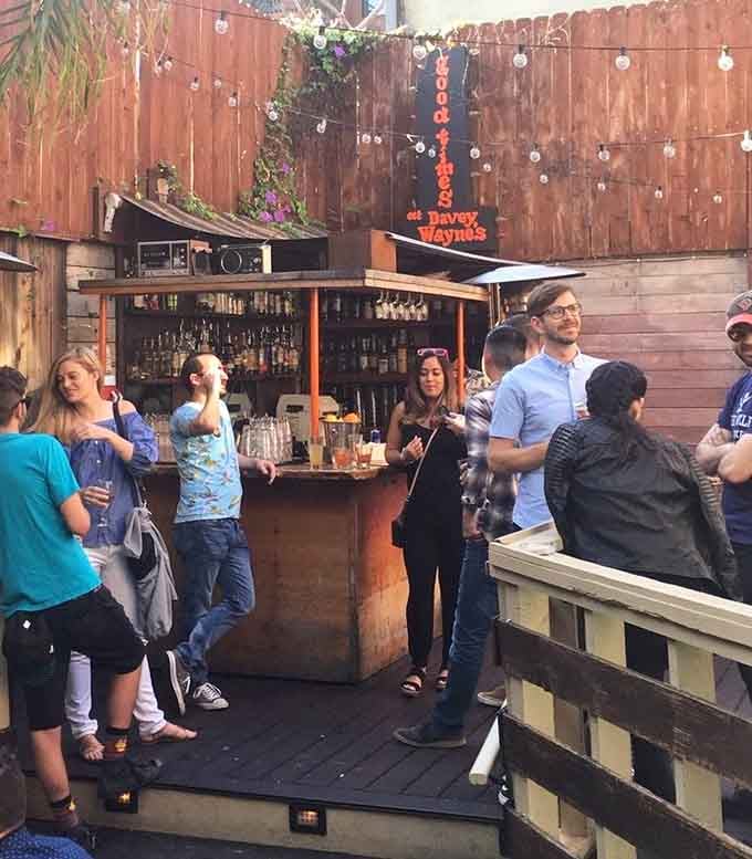 The backyard bar buzzes with happy customers, all soaking in that perfect blend of nostalgia and craft cocktails.