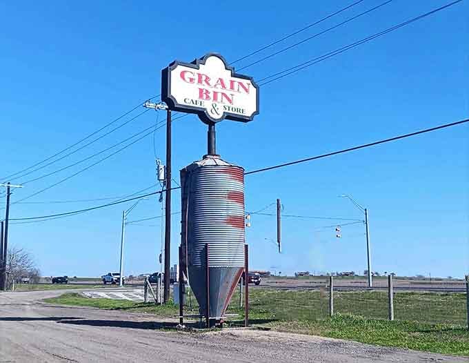 The iconic grain bin sign visible from the road, beckoning hungry travelers to discover Seguin's best-kept secret.