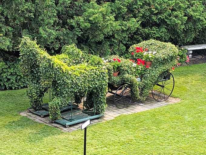 A horse and carriage sculpted entirely from living greenery, because regular topiaries are apparently too ordinary for this place.