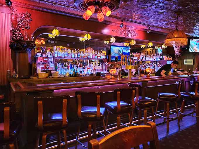 The bar area gleams with ornate details and enough bottles to keep any spirit, living or otherwise, satisfied.