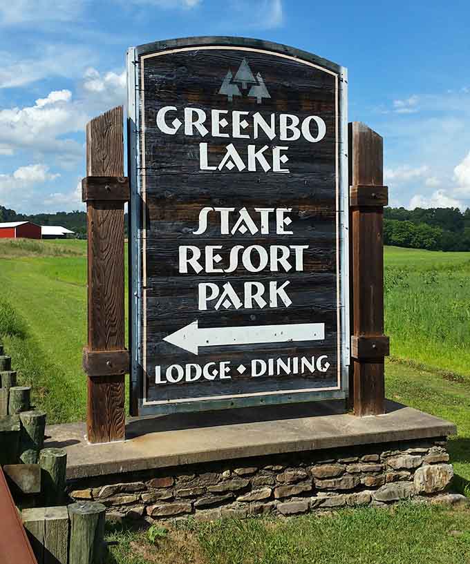 The rustic wooden sign points you toward lodge comfort and dining, your gateway to Kentucky's peaceful secret.