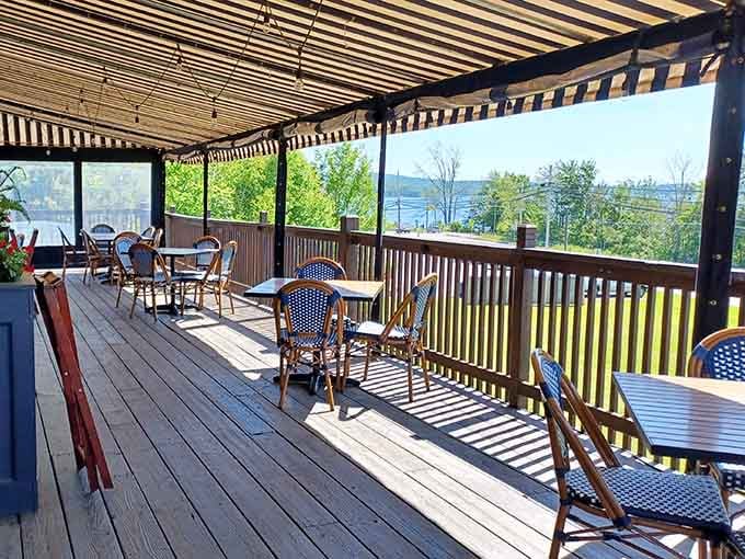 The deck overlooks Lake Wallenpaupack through the trees, offering fresh air dining with your perfectly grilled dinner.