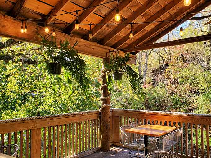 The covered patio offers the perfect blend of fresh air and comfort for enjoying your meal by the river.