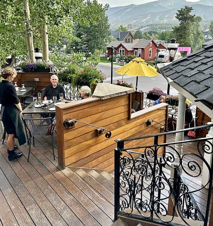 Outdoor deck seating with mountain views turns dinner into an experience you'll be talking about for weeks afterward.