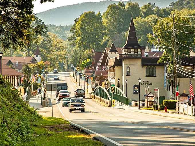 Morning mist rolling down mountains toward Bavarian storefronts creates magic that cameras struggle to fully capture or convey.