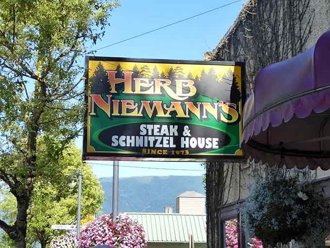 Mountain views framing that classic sign remind you the best meals require a scenic drive.