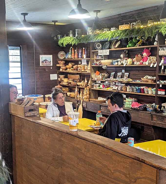 Customers settling in at wooden tables, proving that the best conversations still happen over good food.